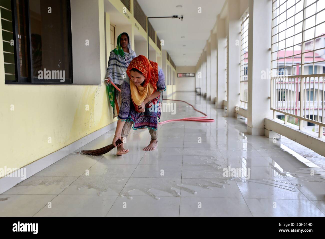 Dhaka, Bangladesh - September 05, 2021: Women are busy cleaning ...