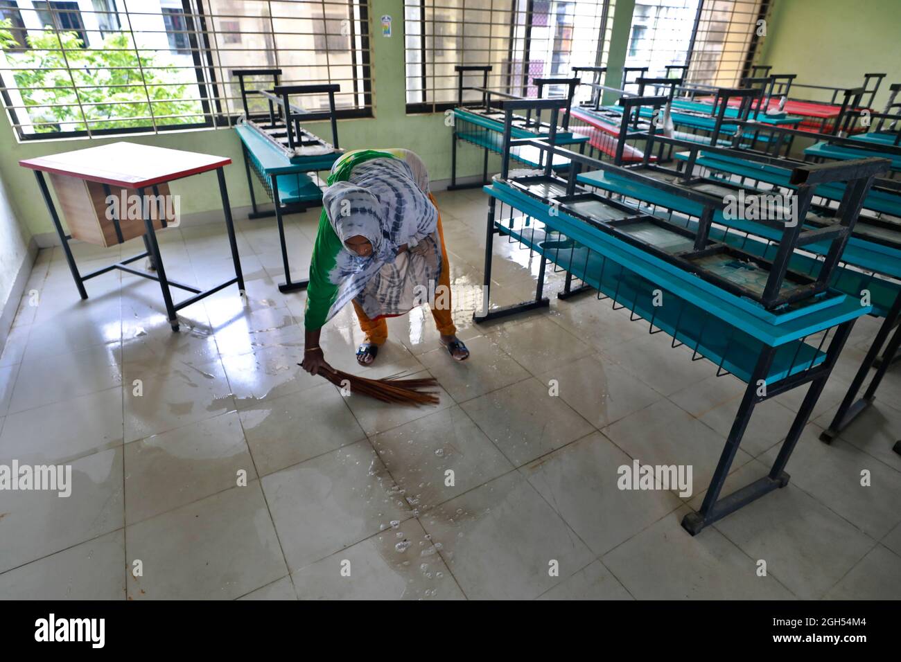 Dhaka, Bangladesh - September 05, 2021: Women are busy cleaning ...