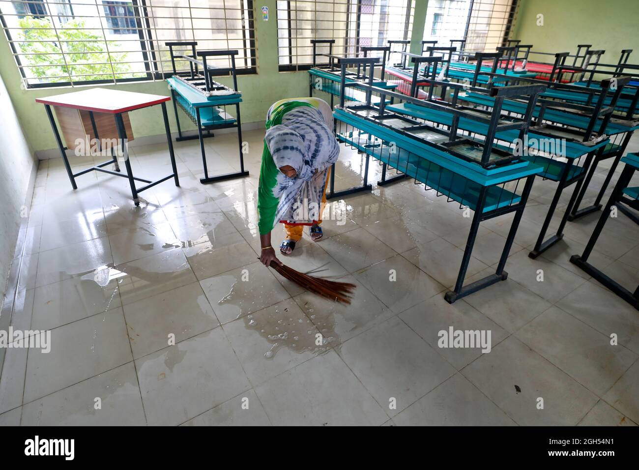 Dhaka, Bangladesh - September 05, 2021: Women are busy cleaning ...