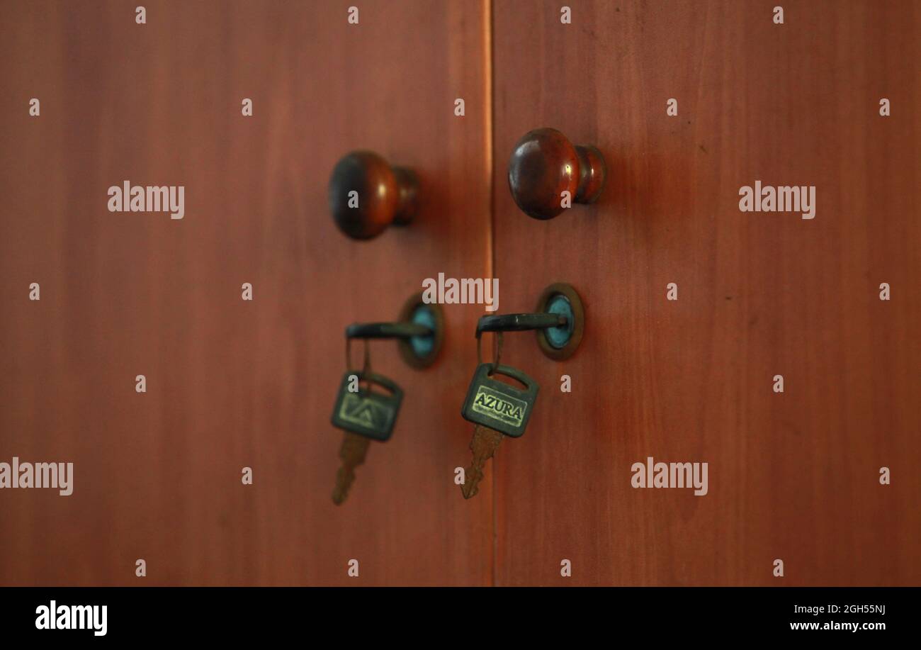 JAKARTA, INDONESIA - Aug 14, 2021: Two keys hanging in the kitchen ...