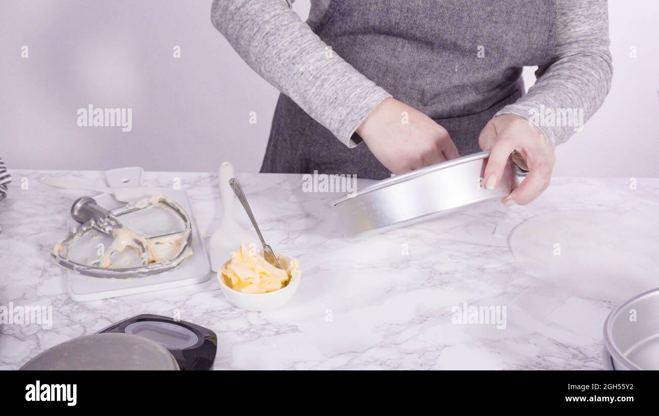 Step by step. Greasing cake pans with butter to bake funfetti cake ...