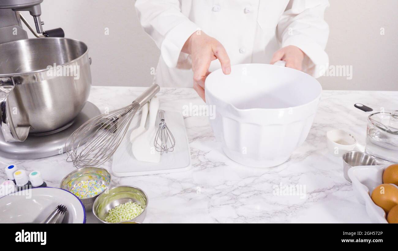 Mixing ingredients italian buttercream frosting hi-res stock ...