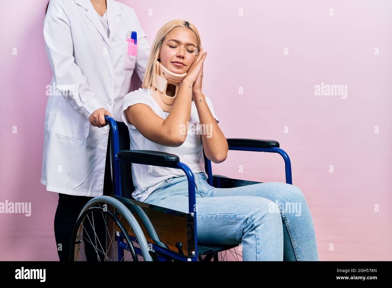 Beautiful blonde woman sitting on wheelchair with collar neck sleeping ...