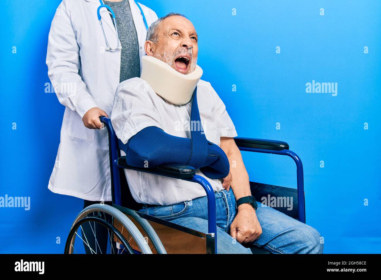 Handsome senior man with beard sitting on wheelchair with neck collar ...