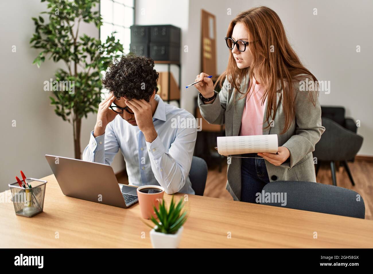 Business boss angry with stressed employee at the office Stock Photo ...