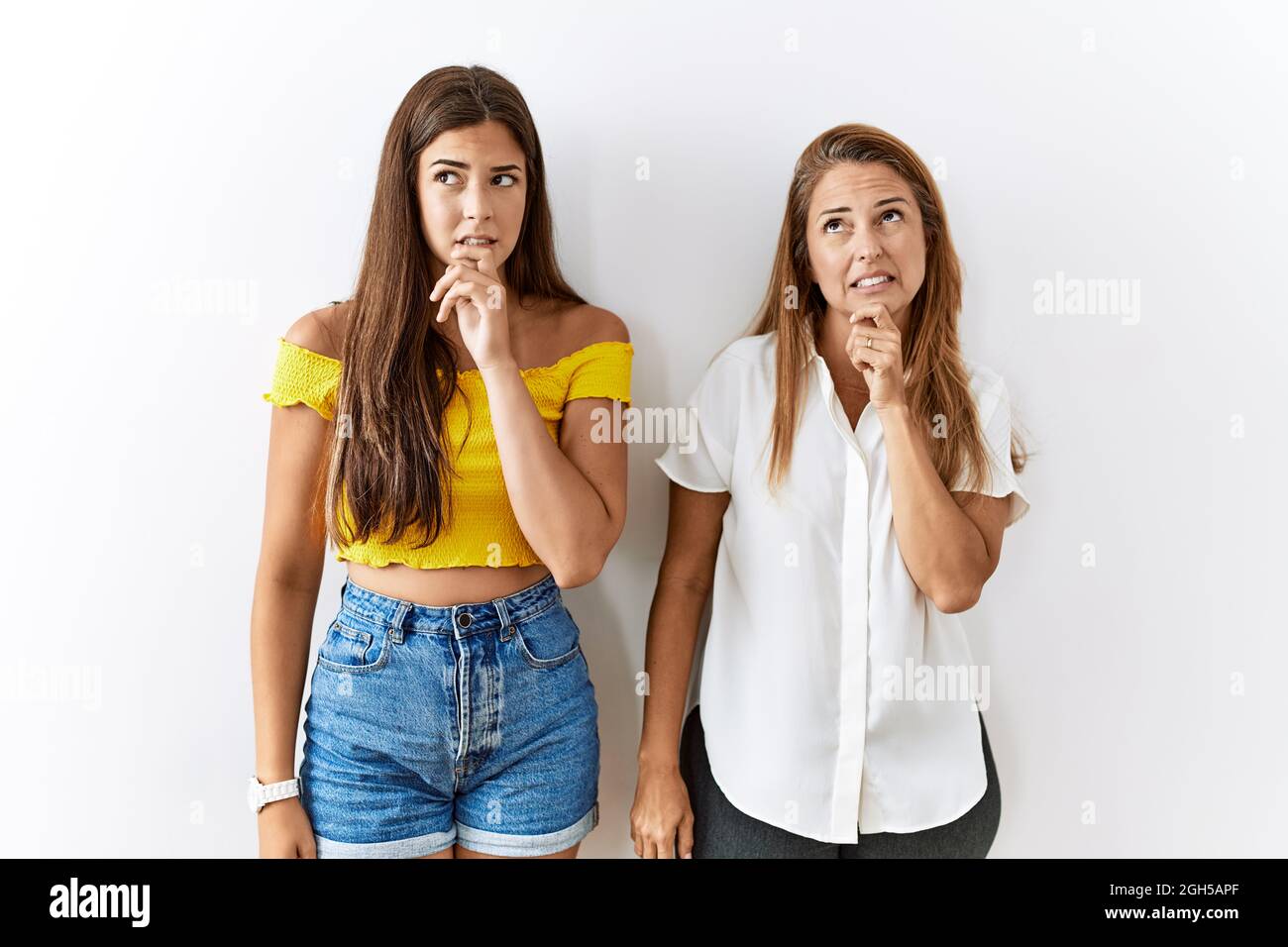 Mother And Daughter Together Standing Together Over Isolated Background