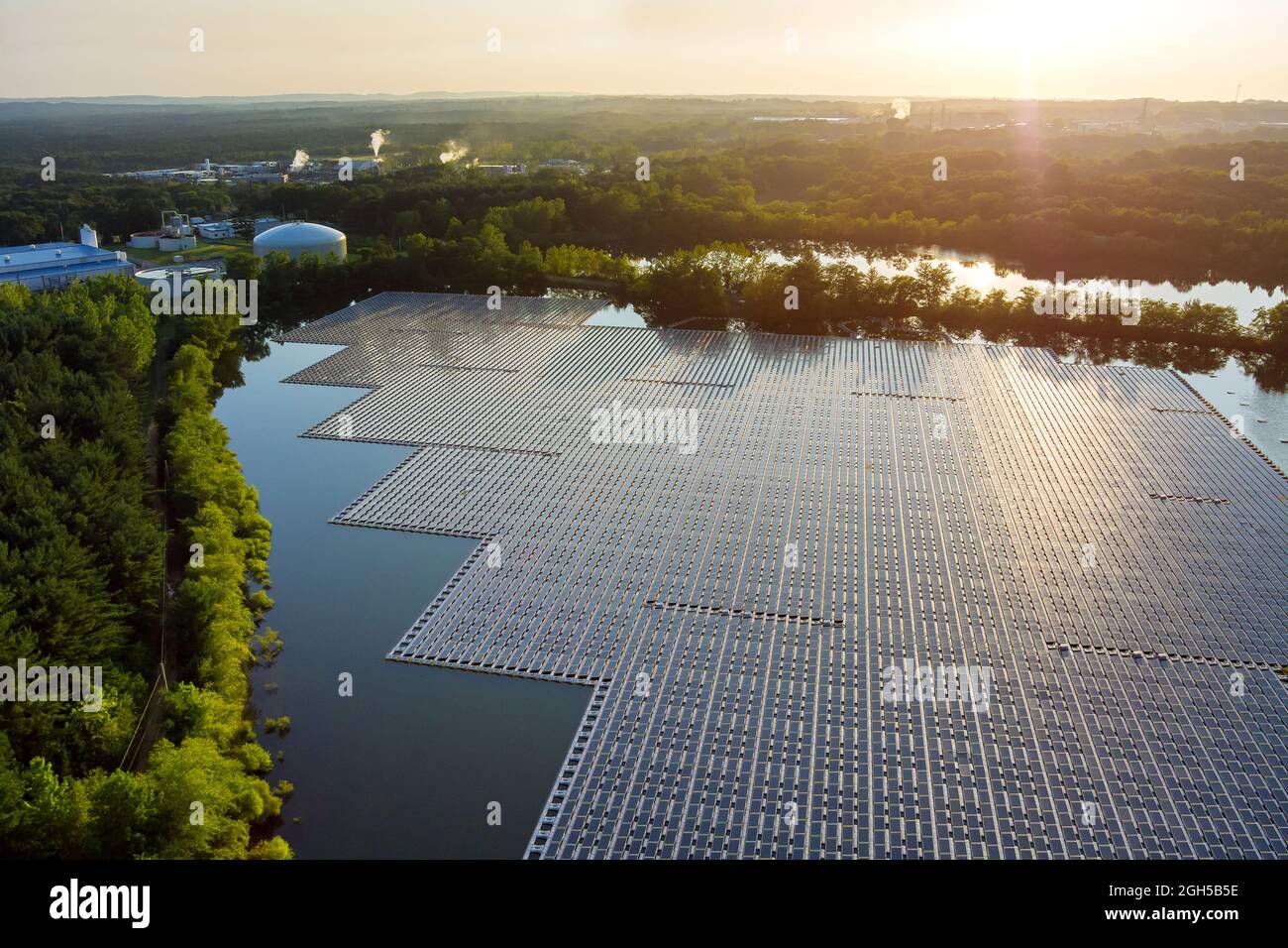 Aerial view of lake in floating solar panels cell platform on renewable ...