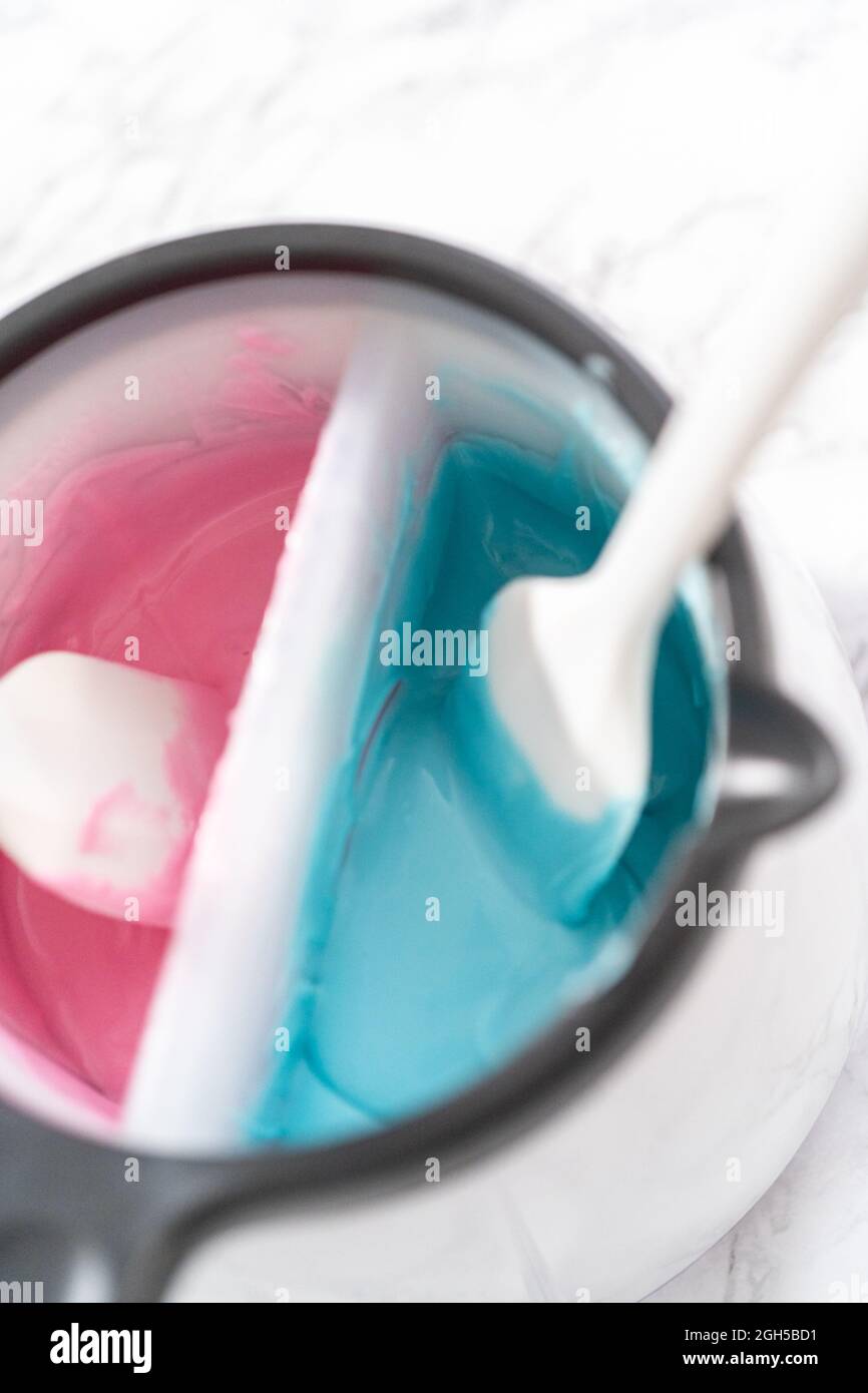 Melting chocolate melts in a candy melting pot to prepare mermaid tails ...