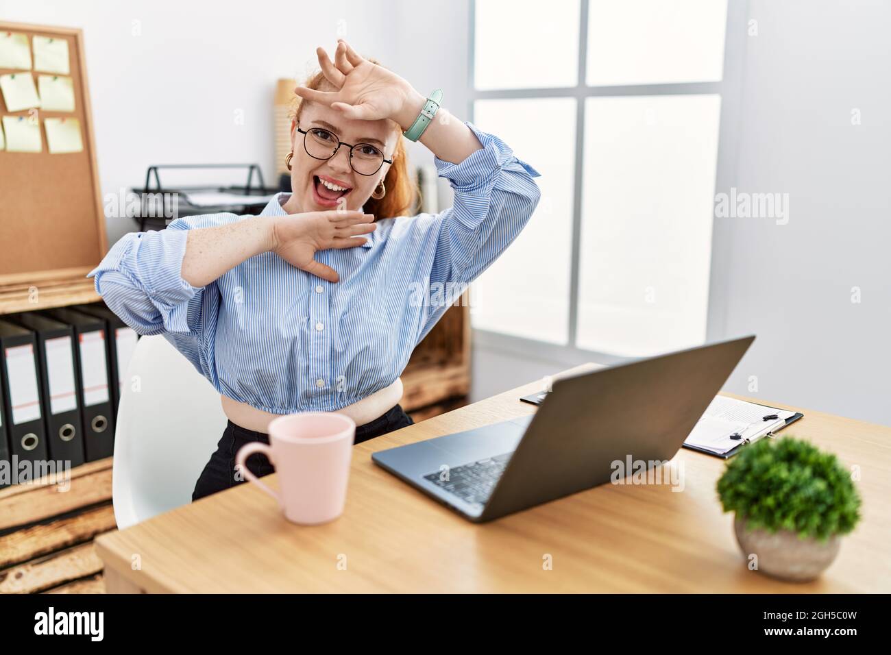 Young Redhead Woman Working At The Office Using Computer Laptop Smiling