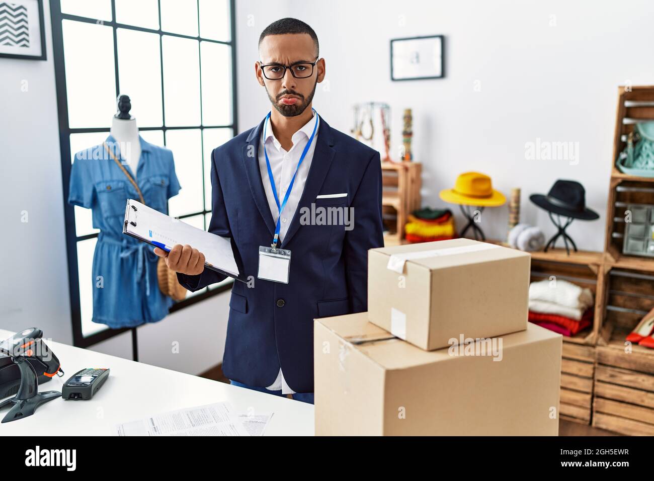 African american man working as manager at retail boutique depressed ...