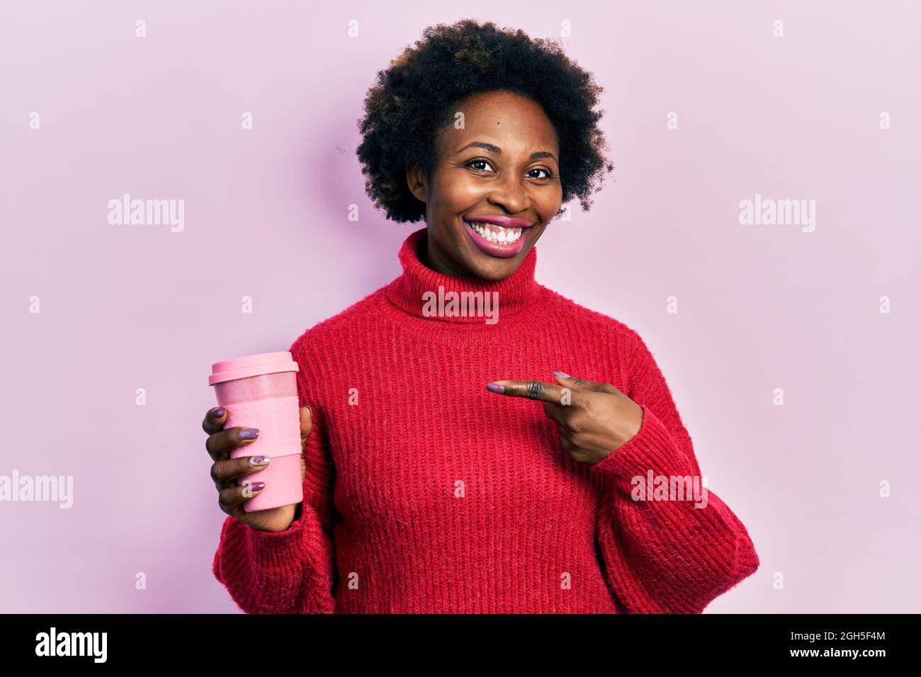 Young African American Woman Drinking A Cup Of Coffee Smiling Happy