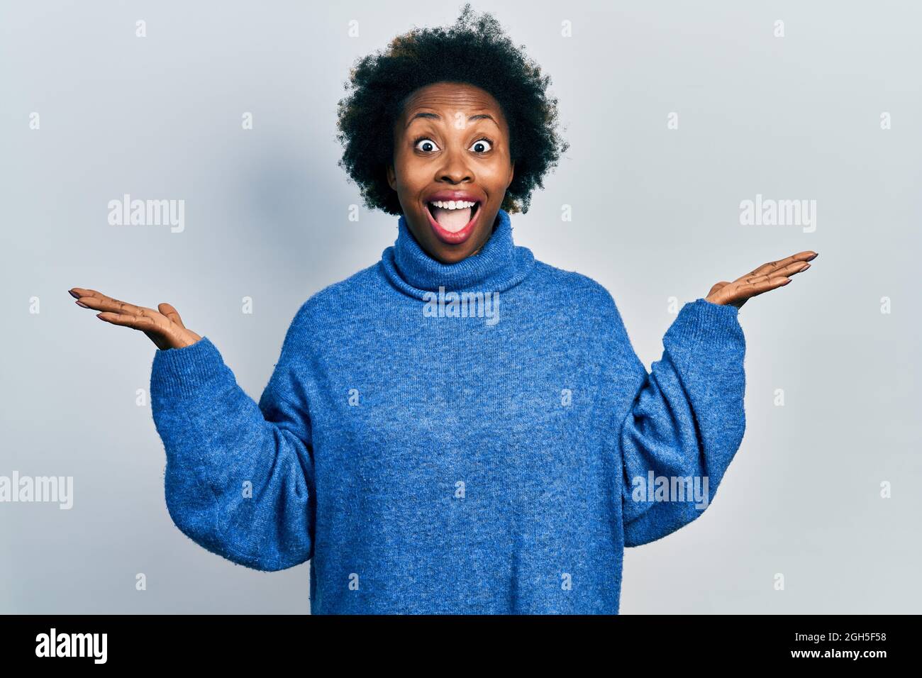 Young african american woman wearing casual clothes celebrating victory ...