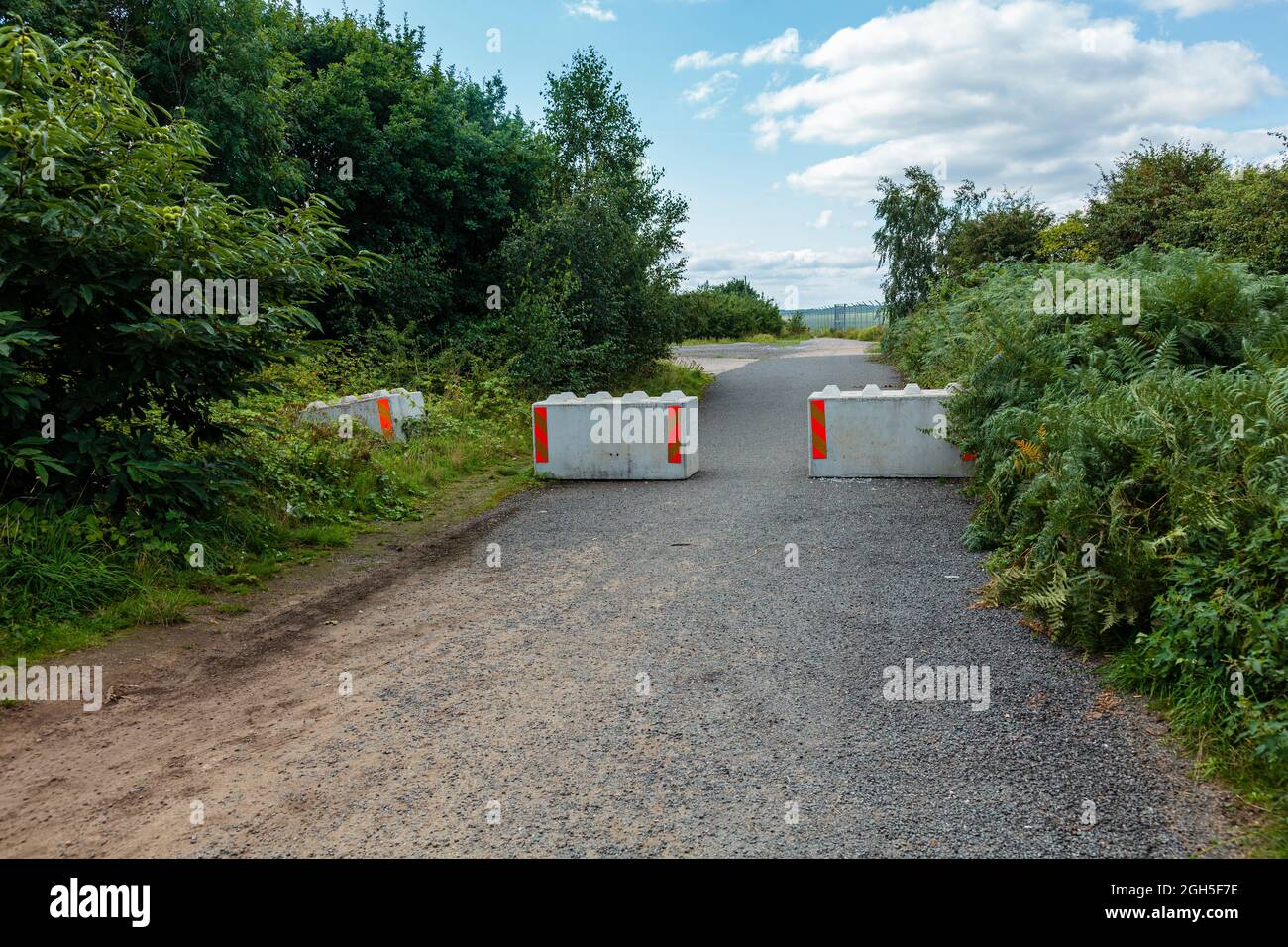 Blocking the road ahead with concrete blocks Stock Photo - Alamy