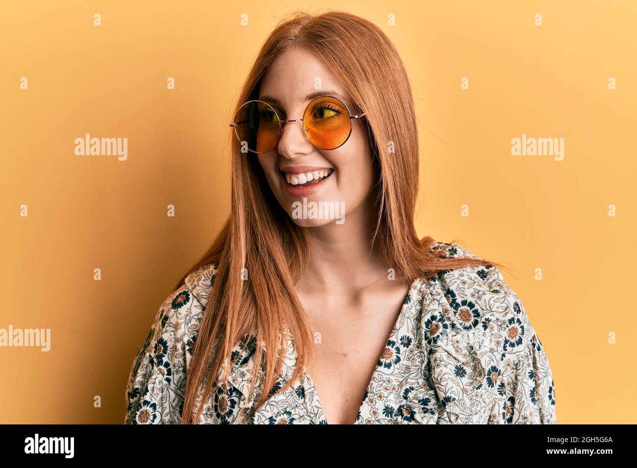 Young irish woman wearing bohemian and hippie style looking away to ...