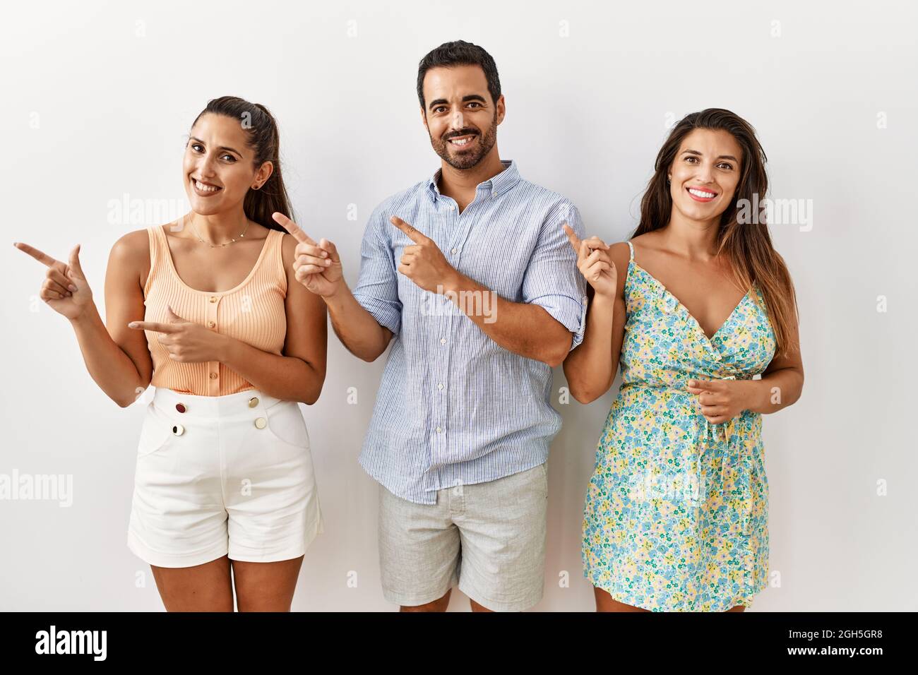 Group of young hispanic people standing over isolated background ...