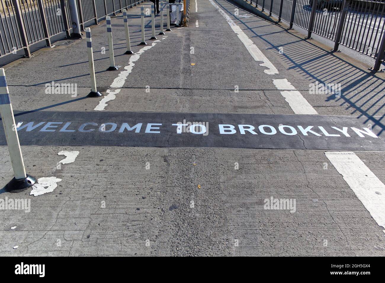 New York, USA - November 22, 2010: Sign on pavement of Brooklyn Bridge ...