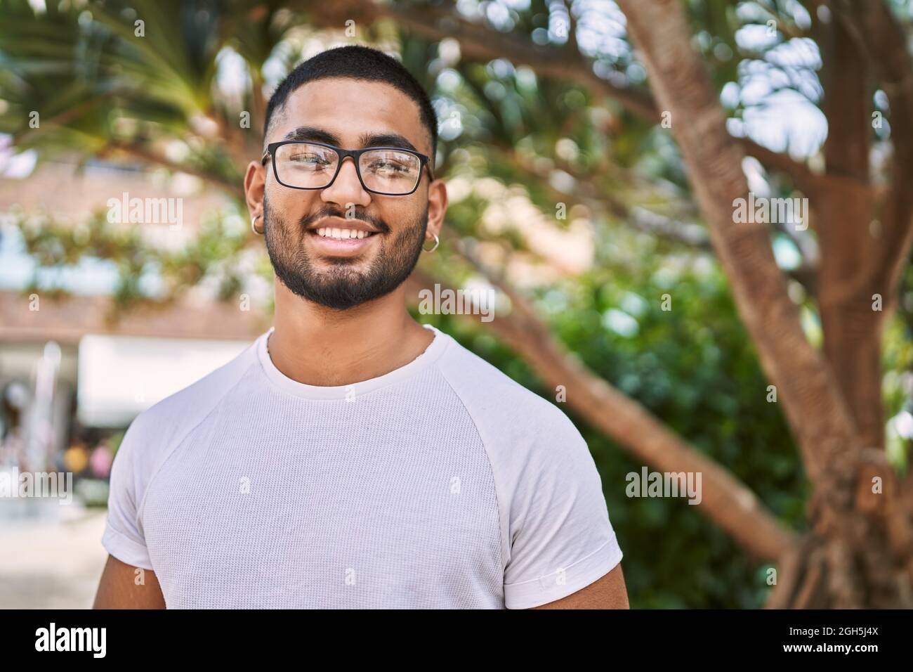 Young middle east man smiling happy standing at the city Stock Photo ...