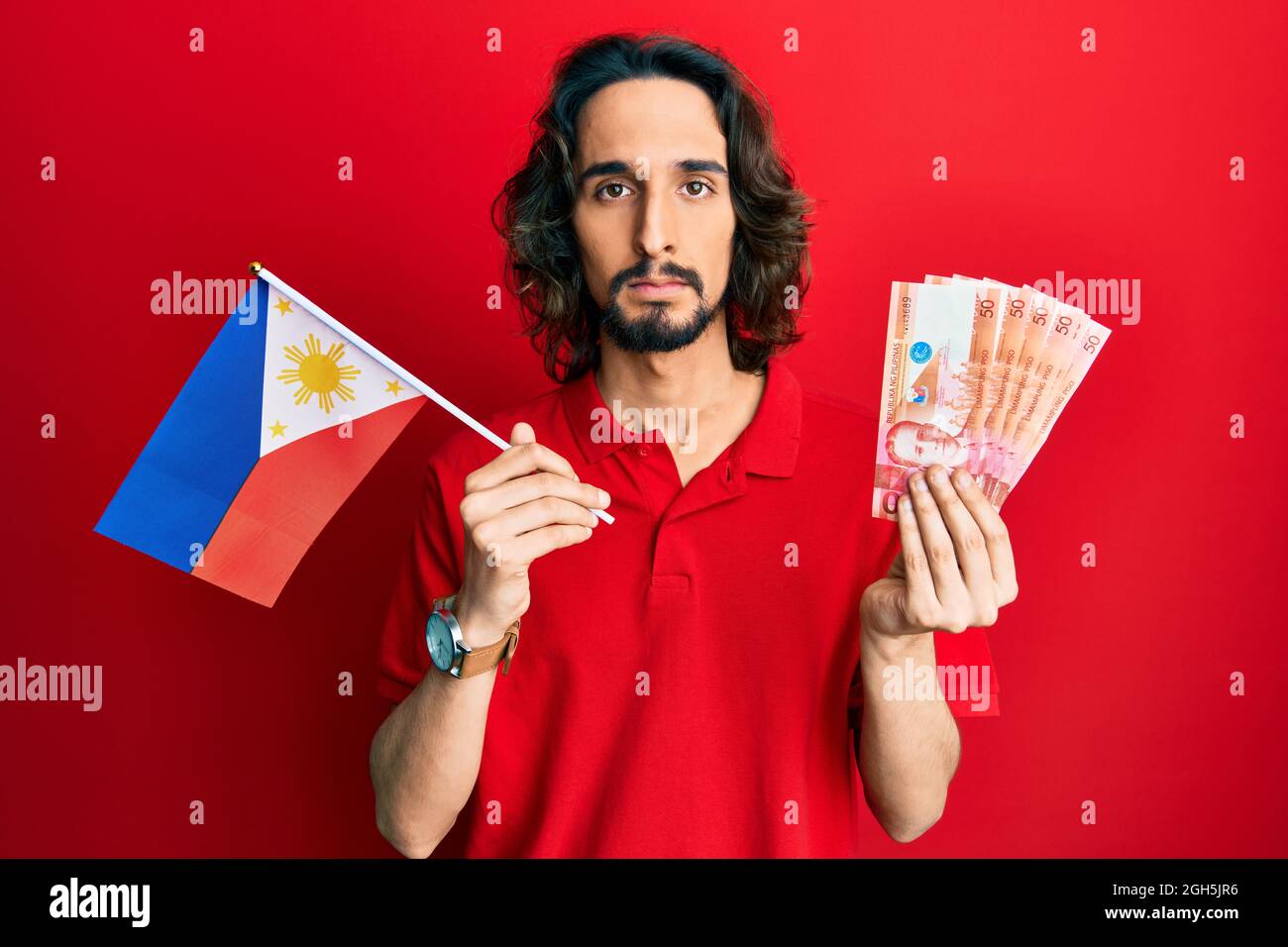 Philippine peso symbol on red hi-res stock photography and images - Alamy