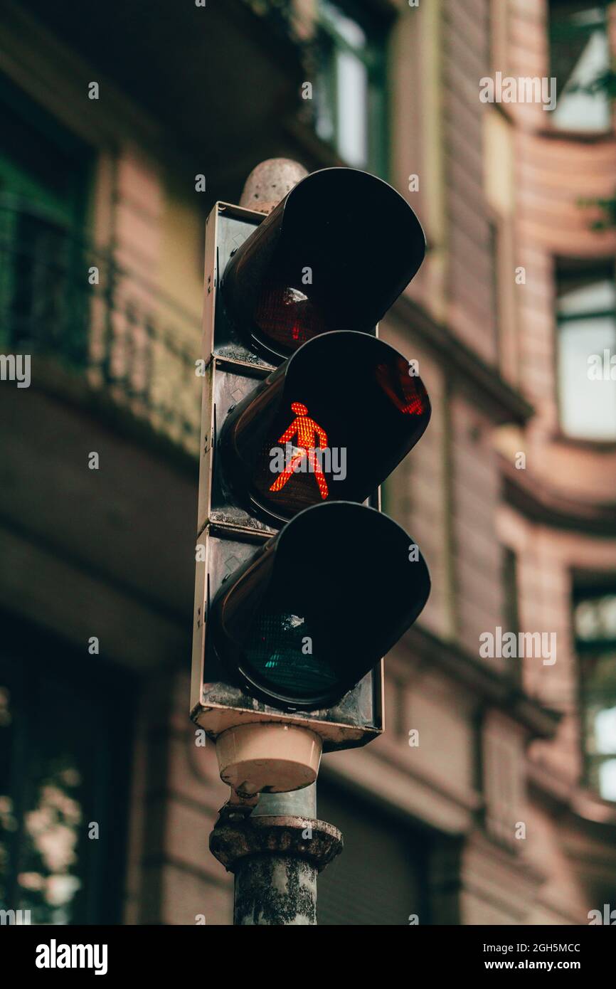 A vertical closeup of a traffic light showing the stop sign for ...