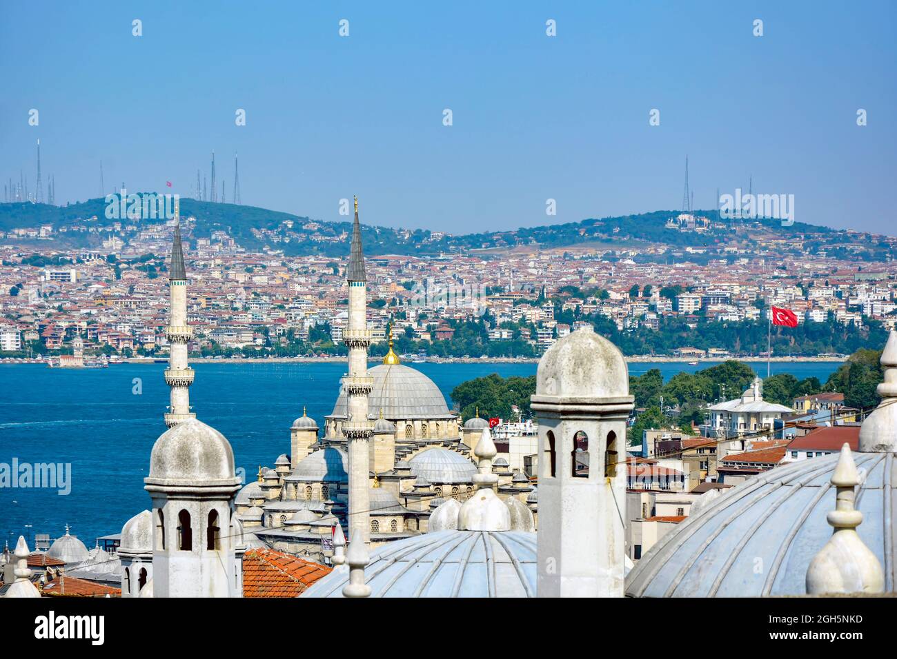 Istanbul cityscape with its minarets, hill, houses and the Bosphorus ...