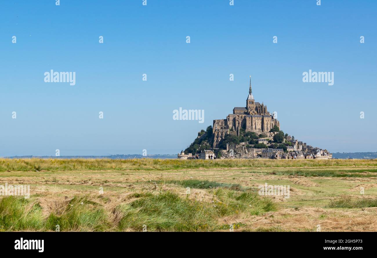 Summer view of the famous historic Mont-Saint-Michel on the background ...