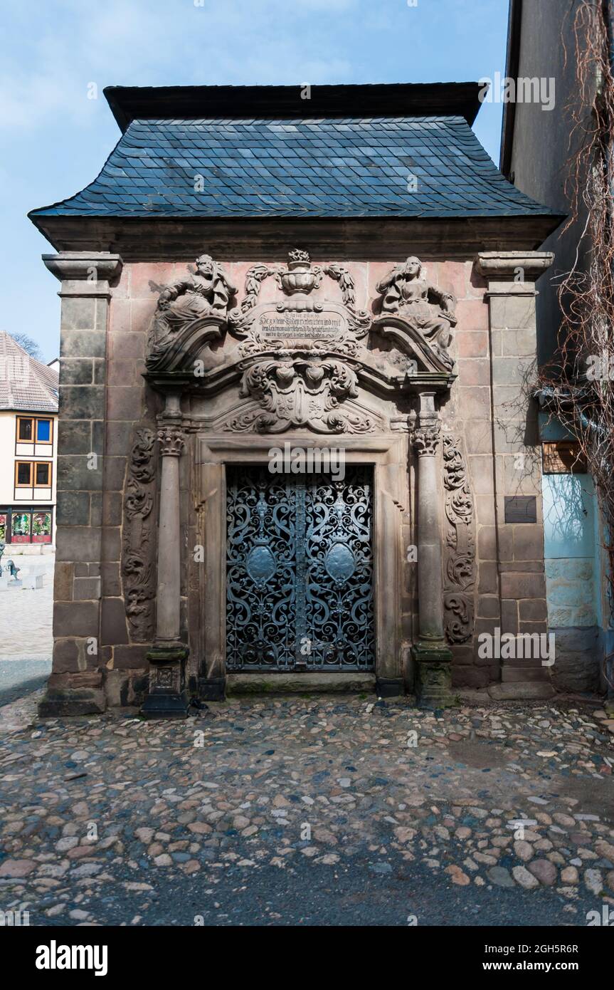 Small, old and heavily decorated building with an impressive door in ...
