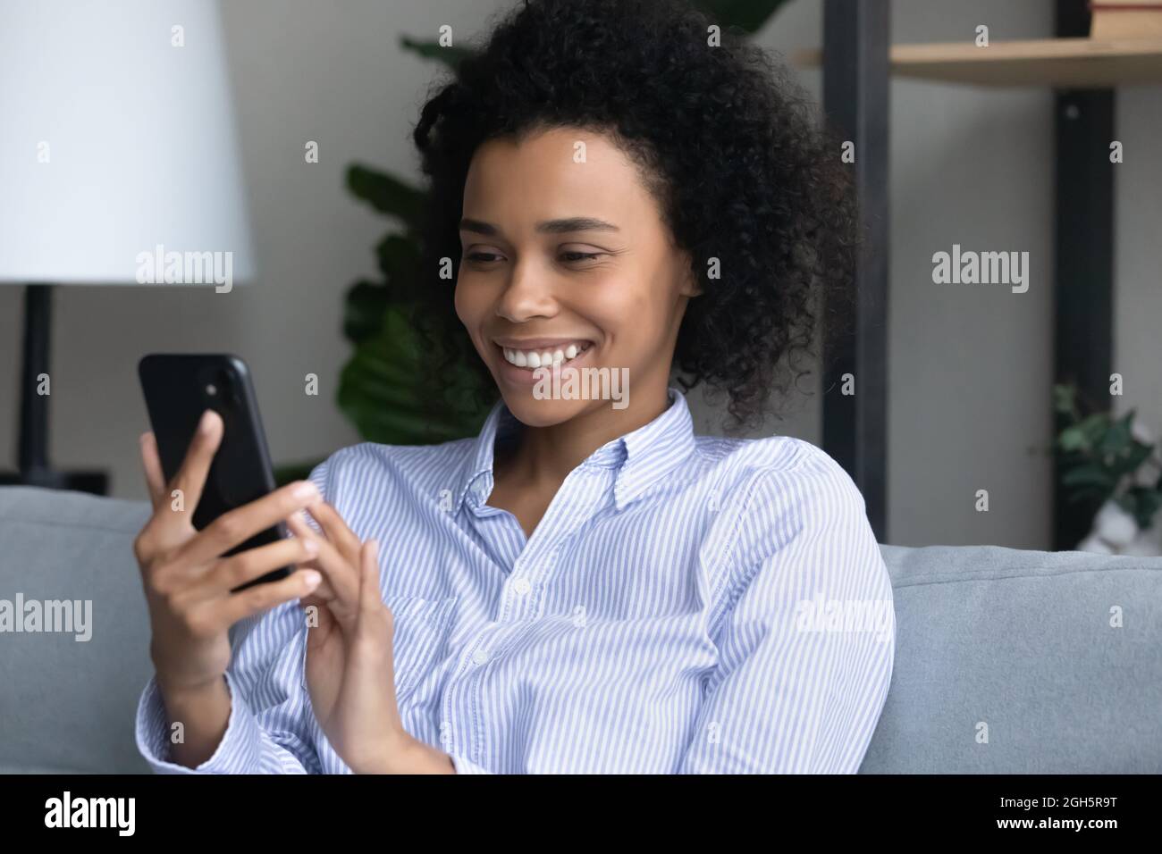 Attractive black gen z female communicate online using modern ...