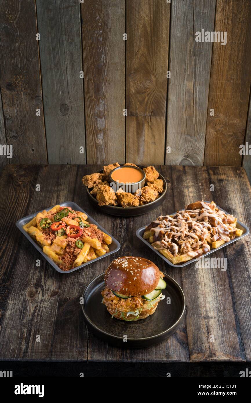 High angle of served table with tasty buffalo cheese fries placed near ...