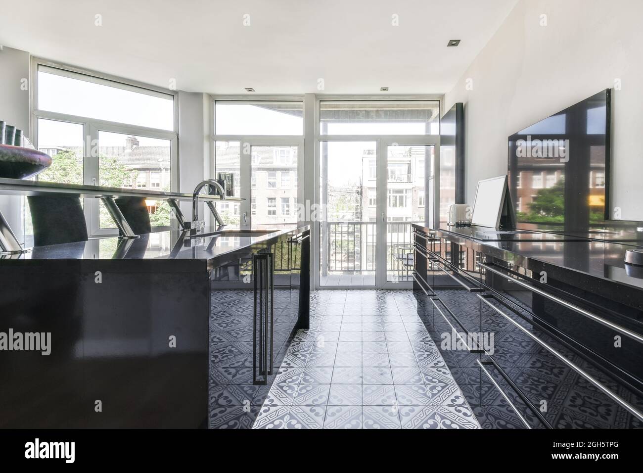 Modern home interior design of spacious open plan kitchen with black ...