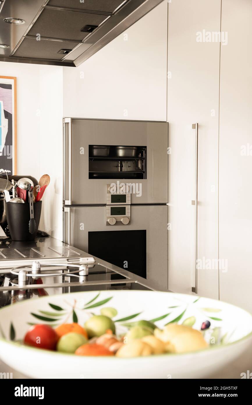 Control panel with switches and display on electric oven in modern home ...