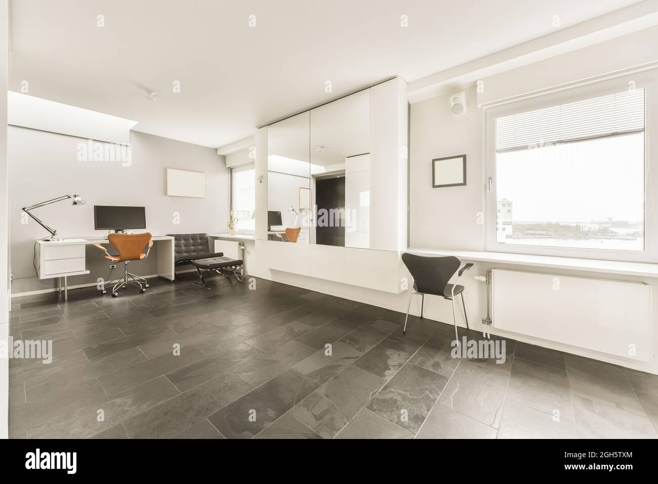 Contemporary loft style interior design of spacious coworking area with ...