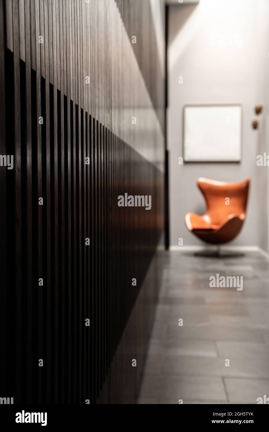 Perspective view of hallway interior with gray striped walls and brown ...