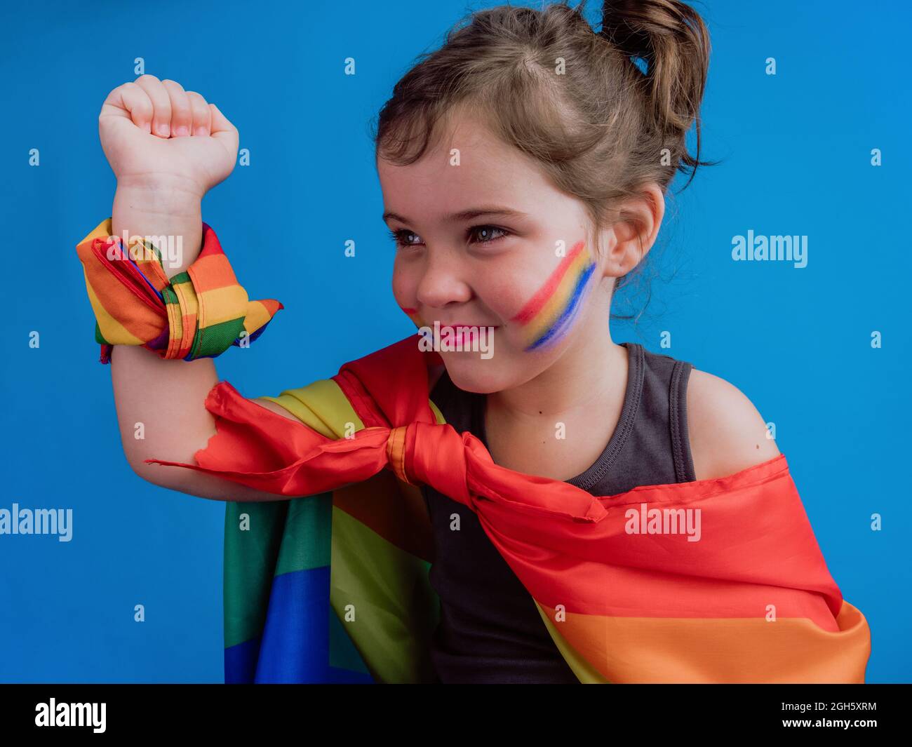 Cute glad child with multicolored bandage on neck and wrist standing ...