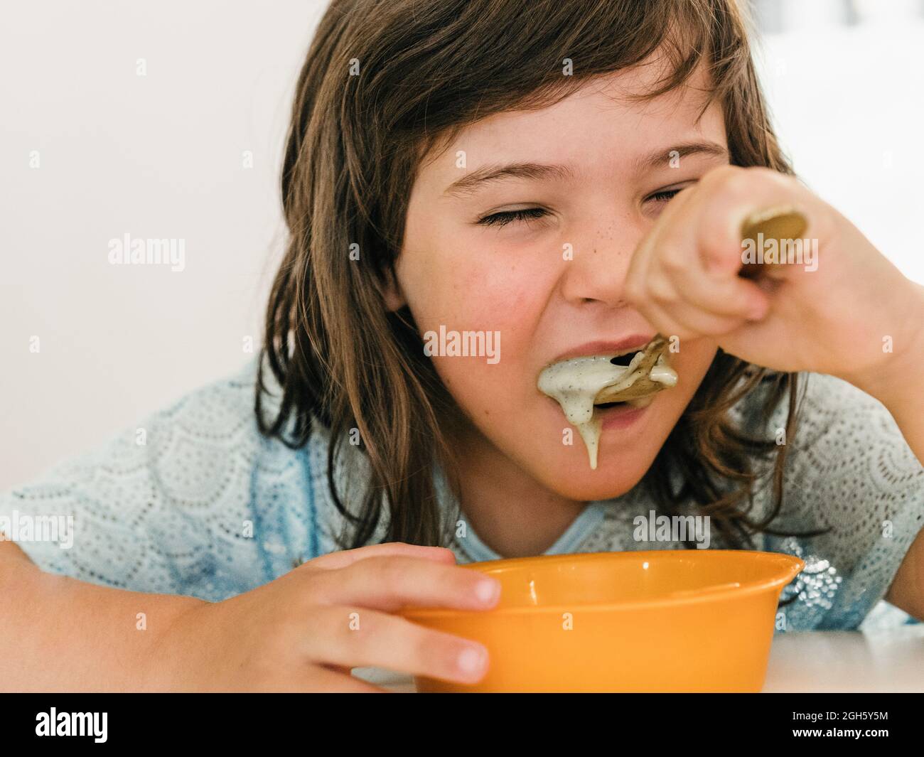 Cute child eating soup from the bowl hi-res stock photography and ...