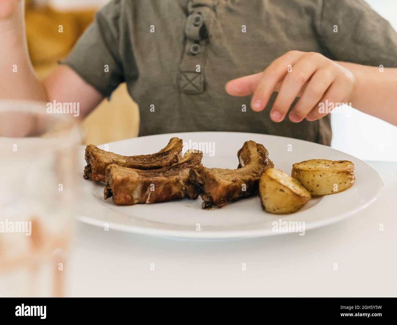 Child eating pork meat hi-res stock photography and images - Alamy