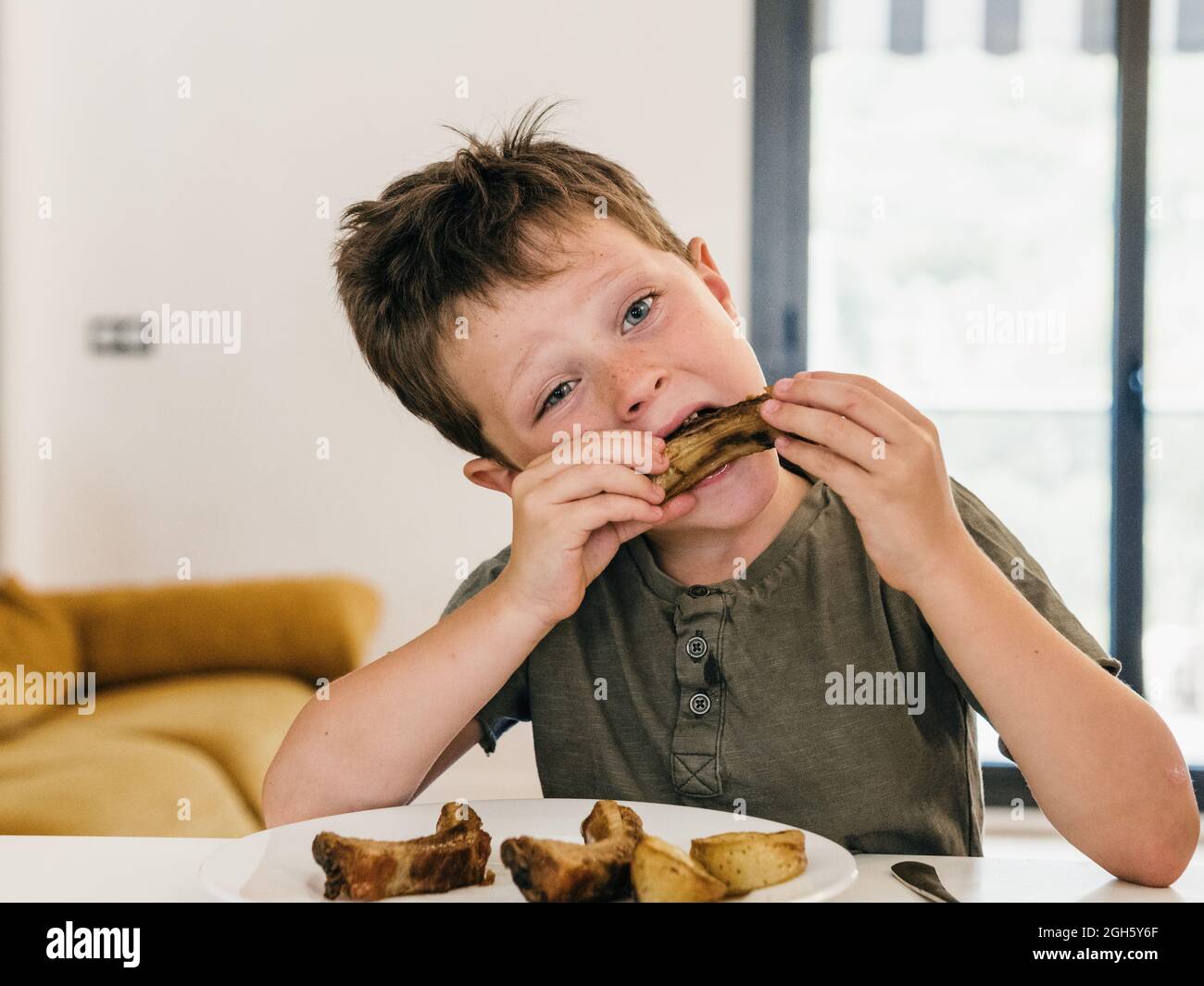Child eating pork meat hi-res stock photography and images - Alamy