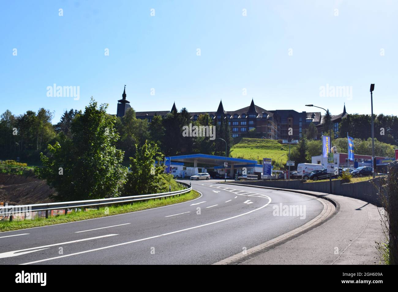 road into Daun in the Eifel with a petrol station on the side Stock ...