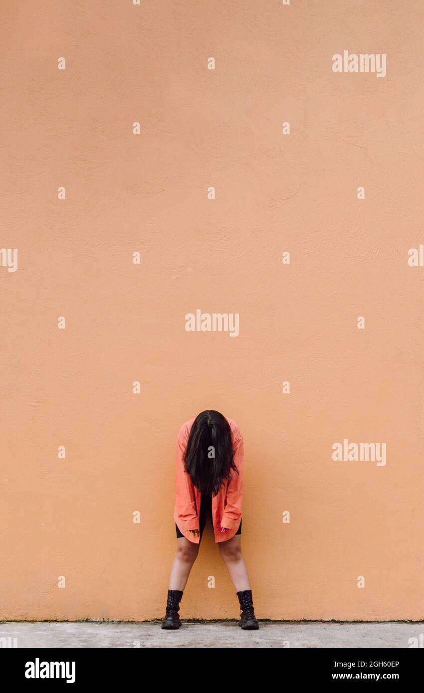 Young brunette bending forward hi-res stock photography and images - Alamy