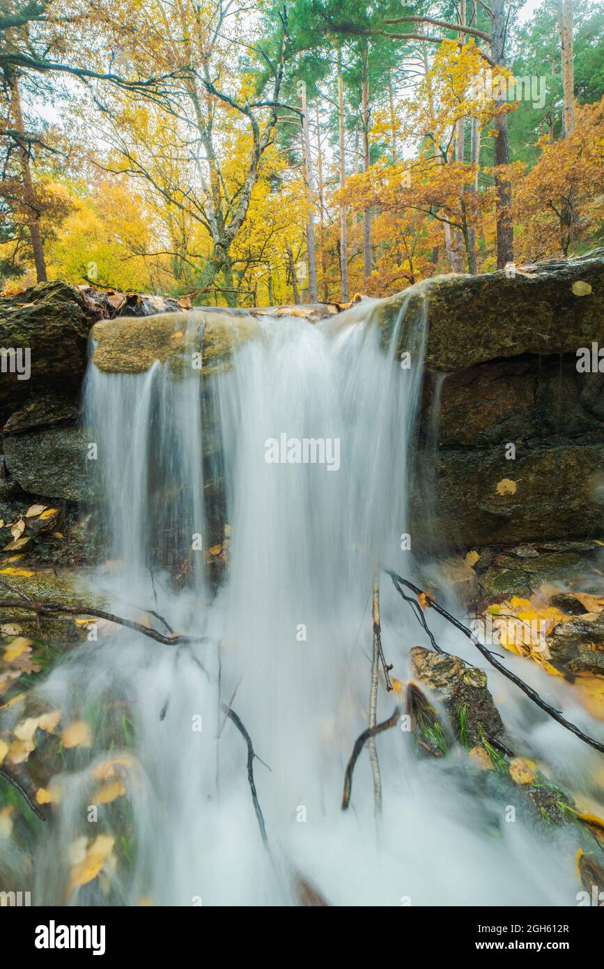 Scenic view of cascades with rapid water streams on mount with colorful ...
