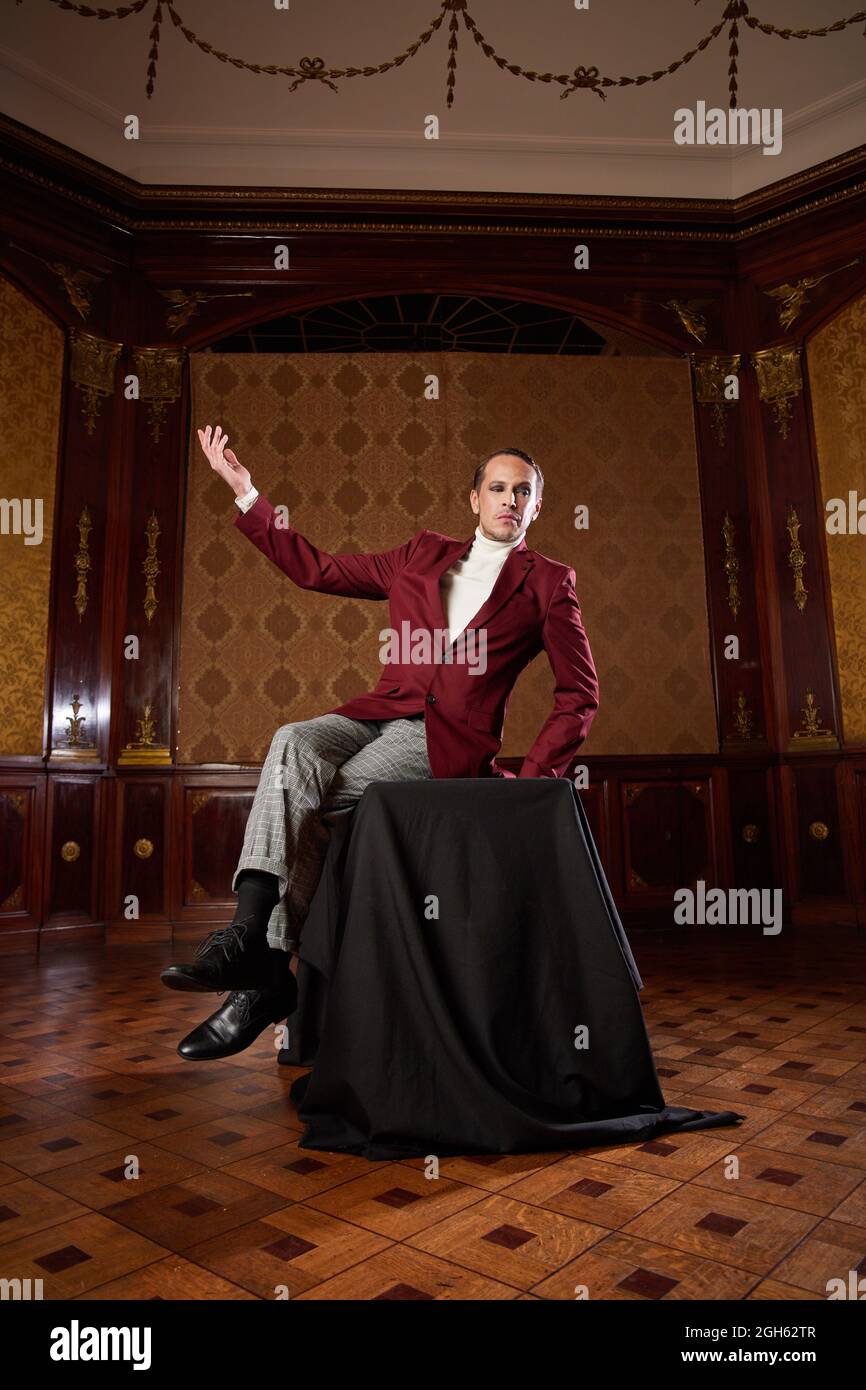 Full body of elegant classy male theater performer in suit ...