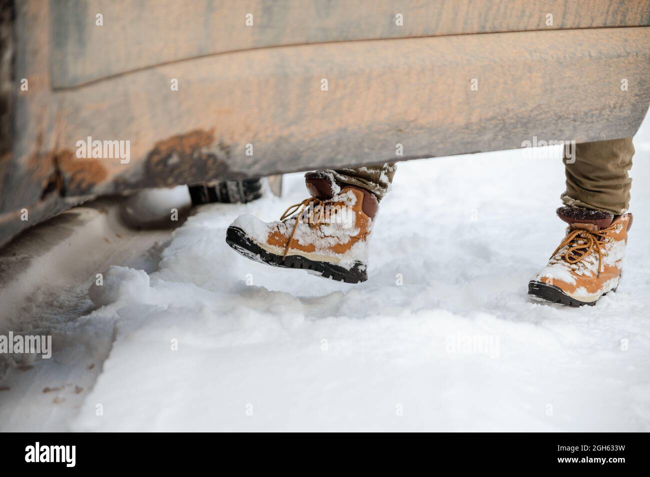 Soft focus of concentrated female bartender looking at glass full of ...