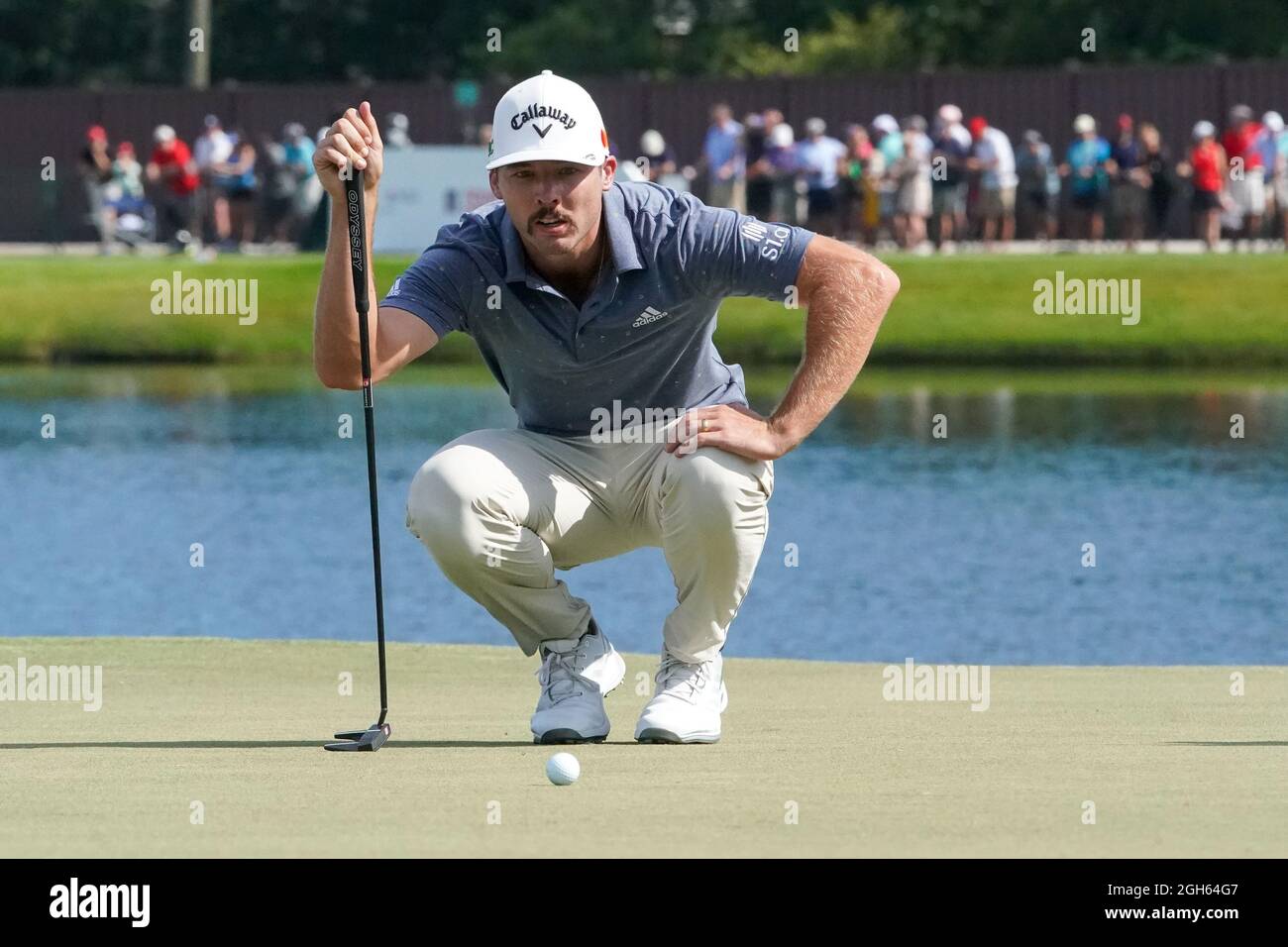 Atlanta, Georgia, USA. 4th Sep, 2021. Sam Burns lines up a putt on the ...