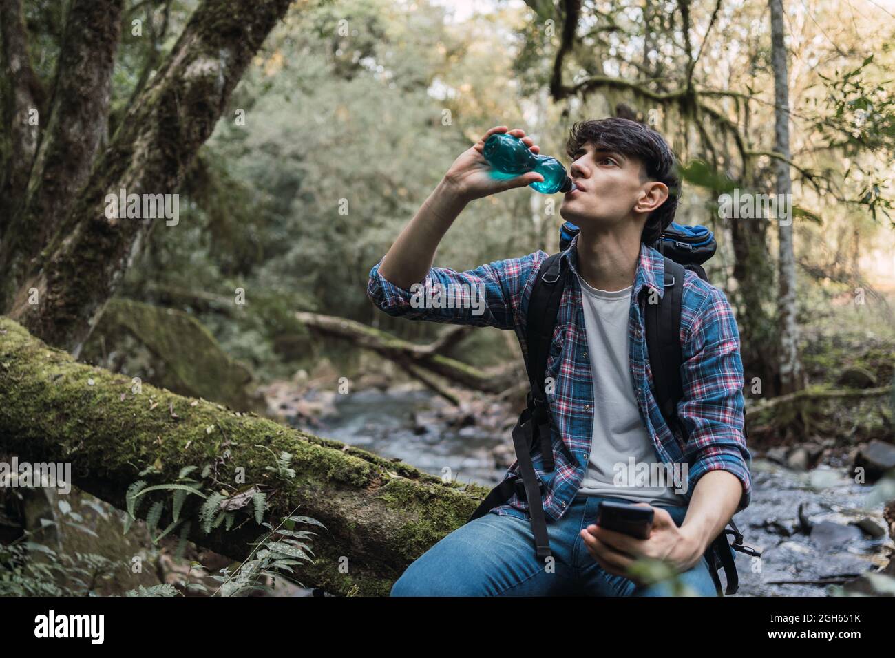 Man drinking water waterfall hi-res stock photography and images - Alamy