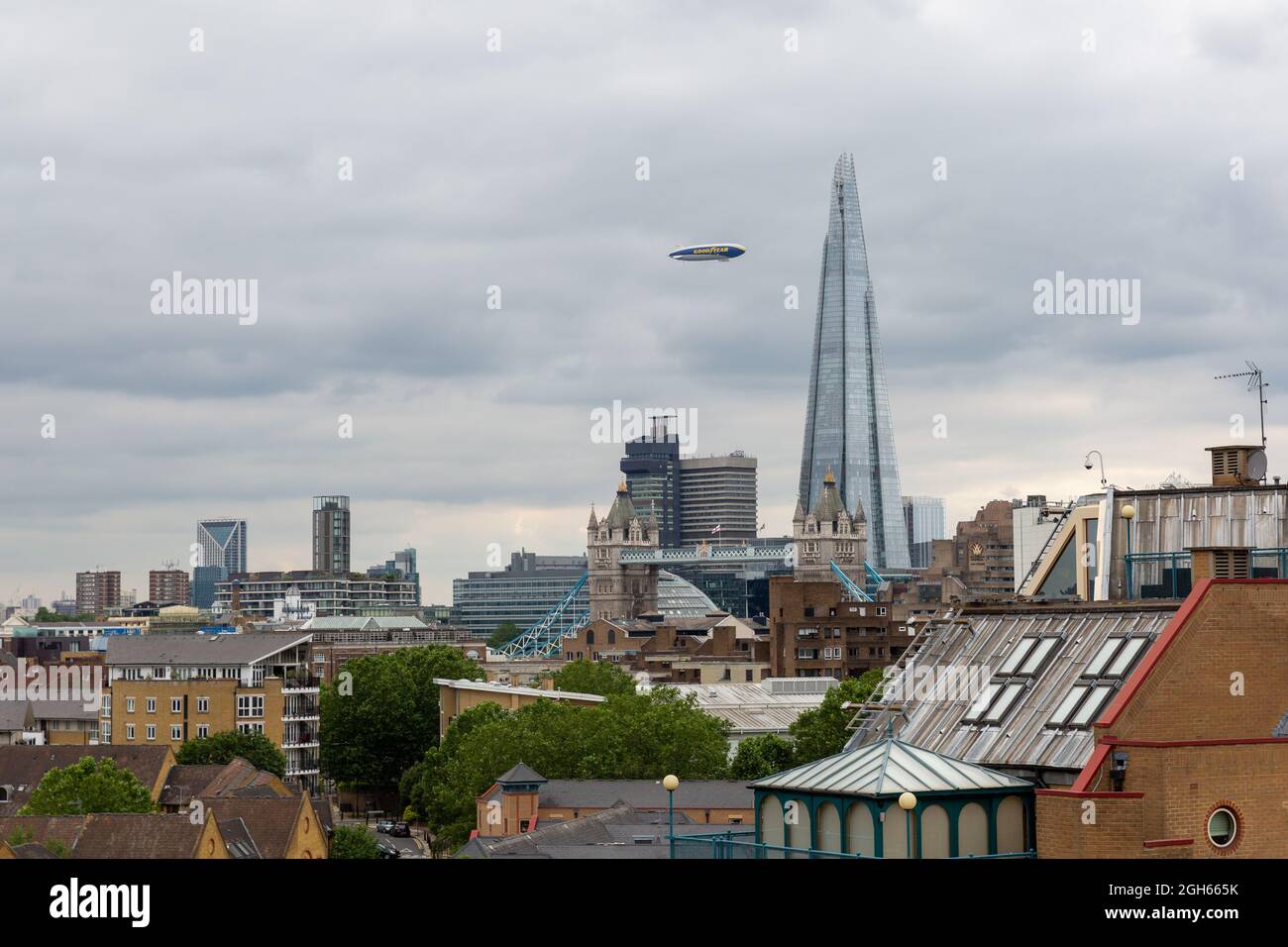 Good Year blimp over Tower Bridge, London Stock Photo - Alamy