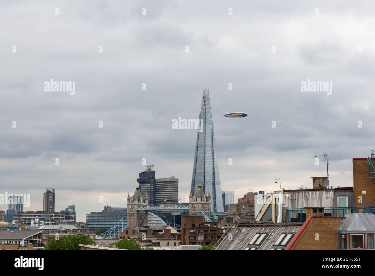 Good Year blimp over Tower Bridge, London Stock Photo - Alamy