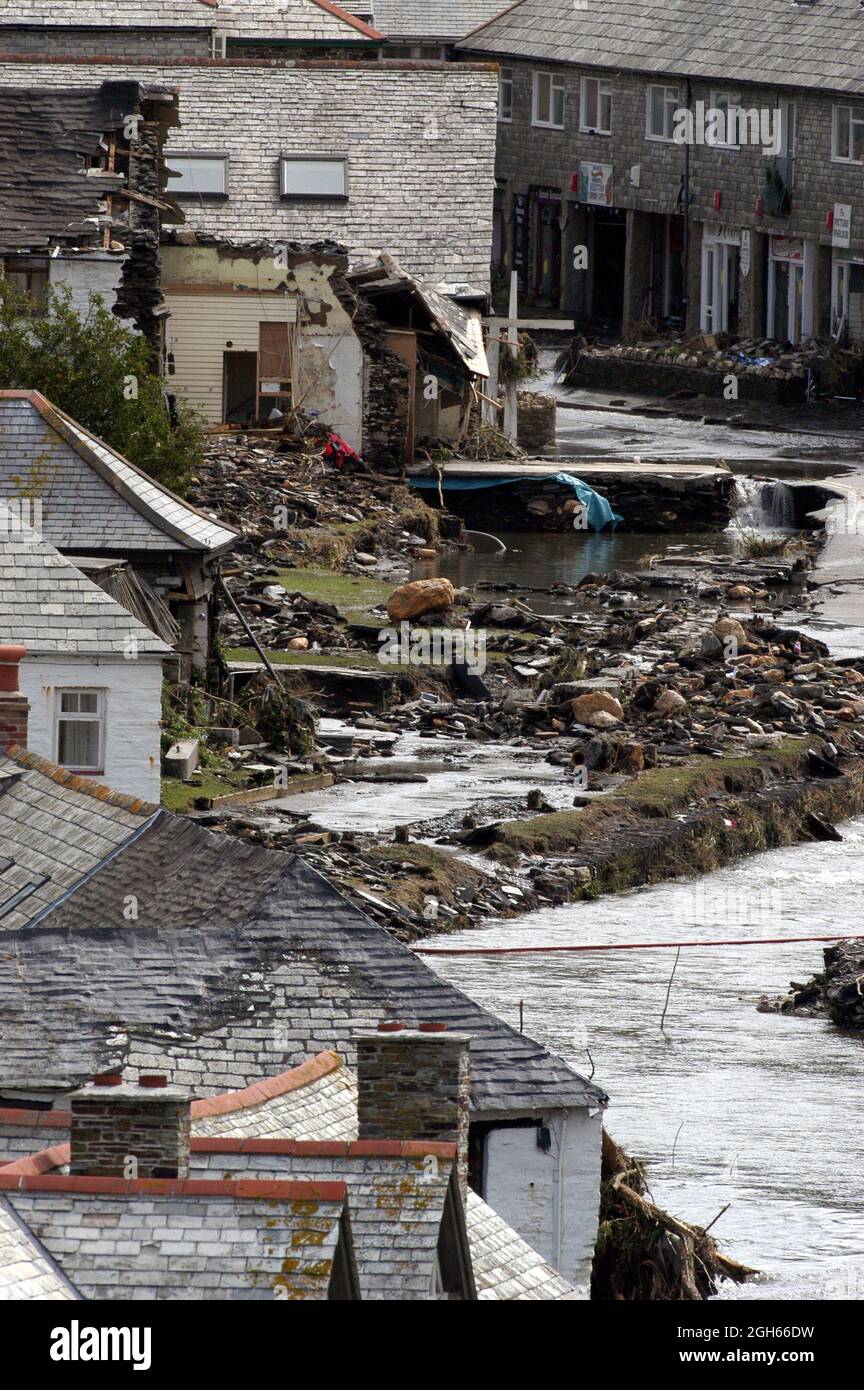 Rescue workers look at the flood devastation after heavy rainfall ...