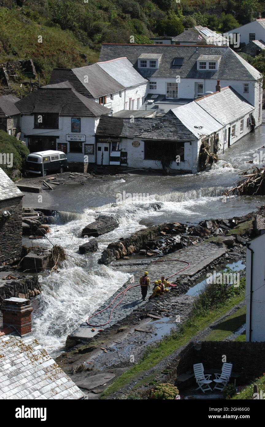 Rescue workers look at the flood devastation after heavy rainfall ...