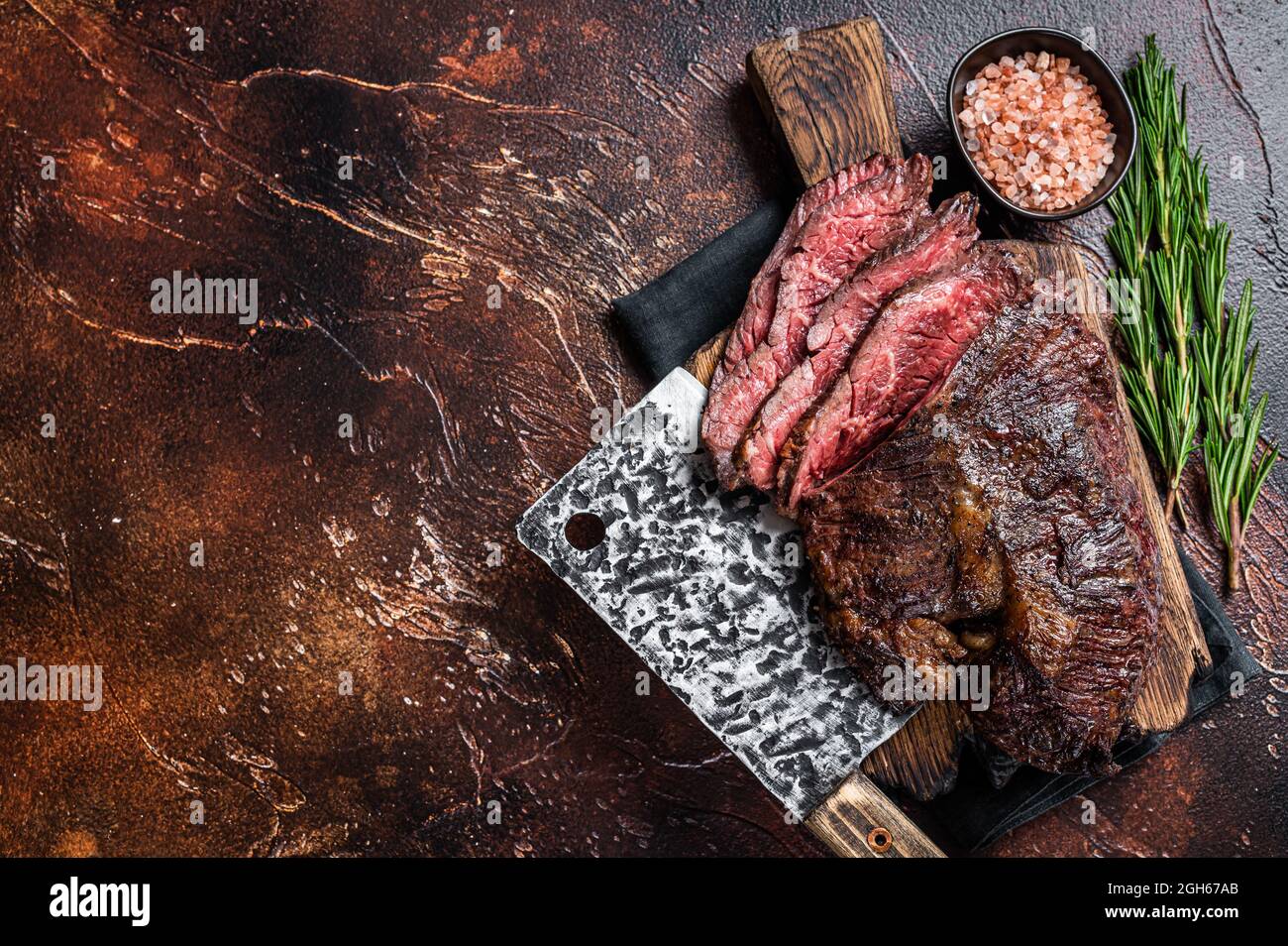 Roasted hanging tender or Onglet sliced beef meat steak on a butcher ...