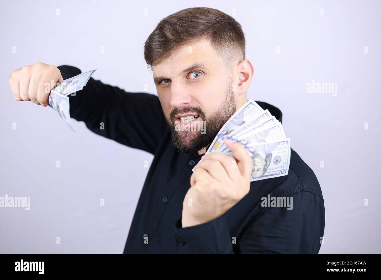 Man counts cash holds in hi-res stock photography and images - Alamy