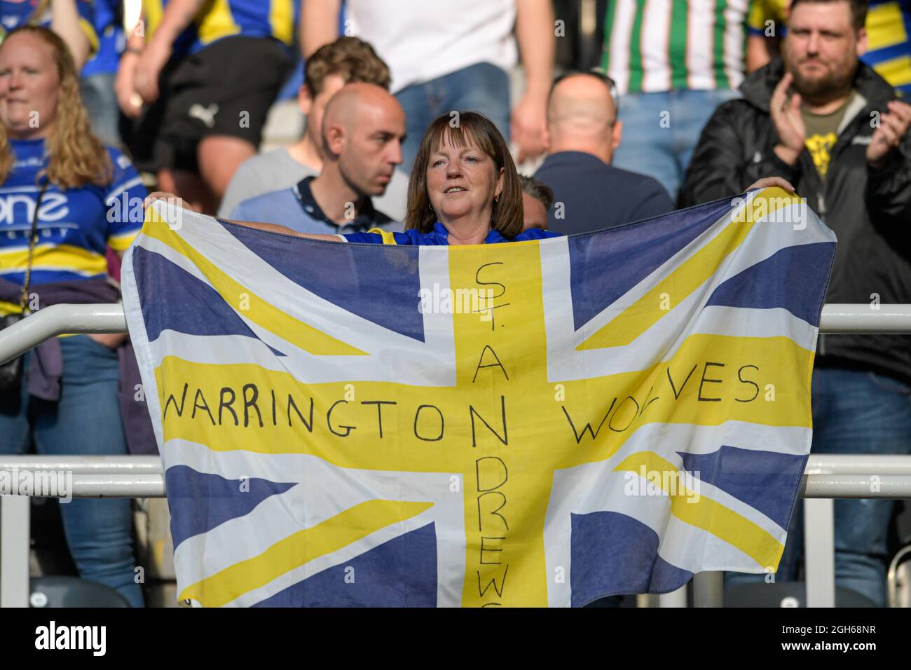 A Warrington Wolves fan shows her flag after seeing her team beat Wigan ...